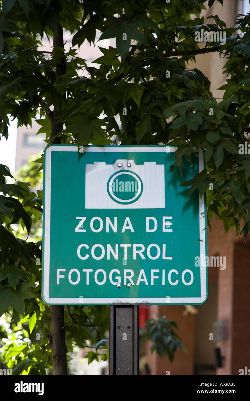 Spanish No Photography Zone sign attached to a post at Santiago de ...
