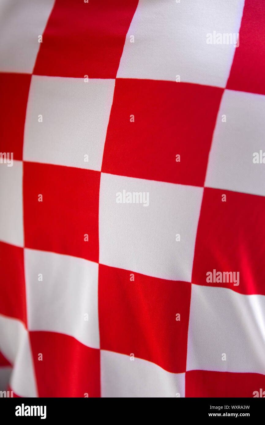 Closeup of red checkered flag texture for backdrop Stock Photo - Alamy