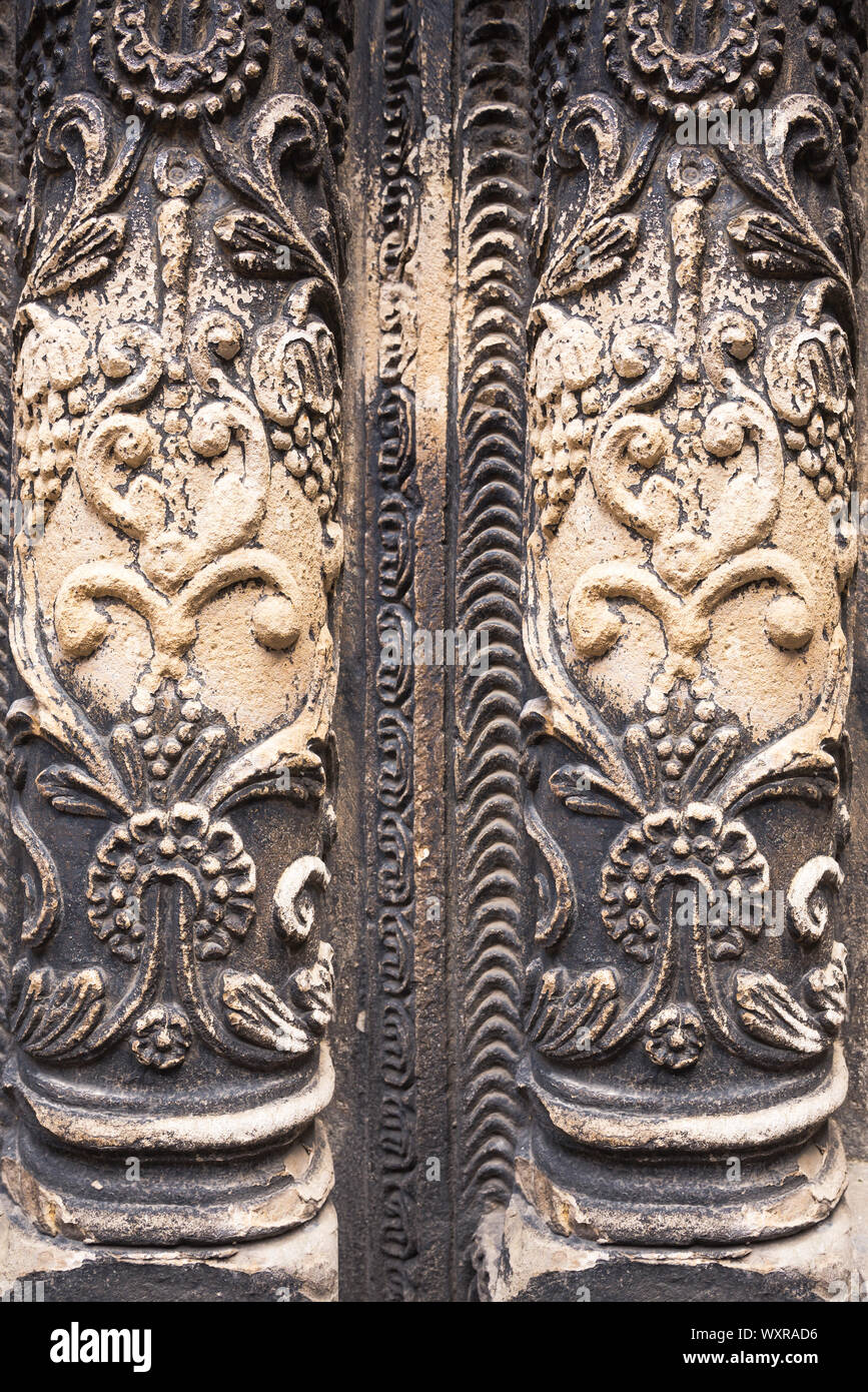 Ancient columns with Renaissance bas-reliefs and plants patterns in the ...