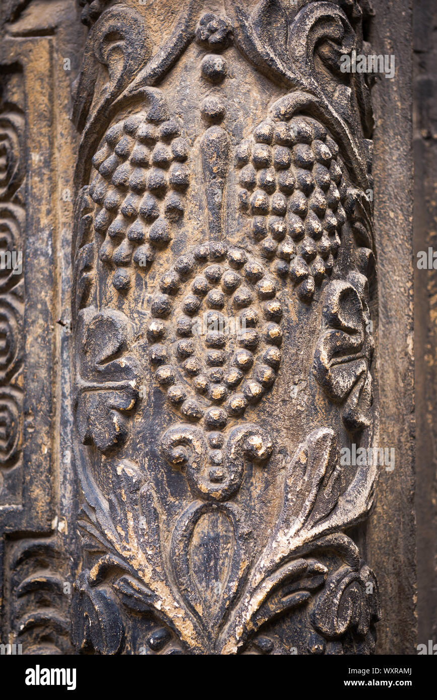 Ancient columns with Renaissance bas-reliefs and plants patterns in the ...