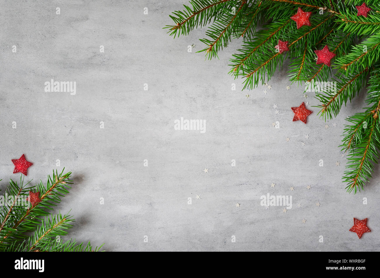Christmas background with decorations and red stars on the gray stone ...