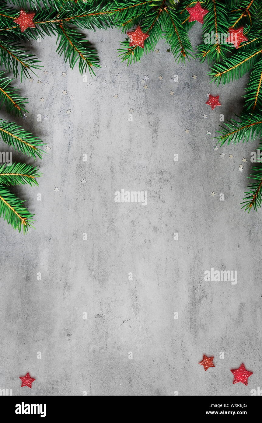 Christmas background with decorations and red stars on the gray stone ...