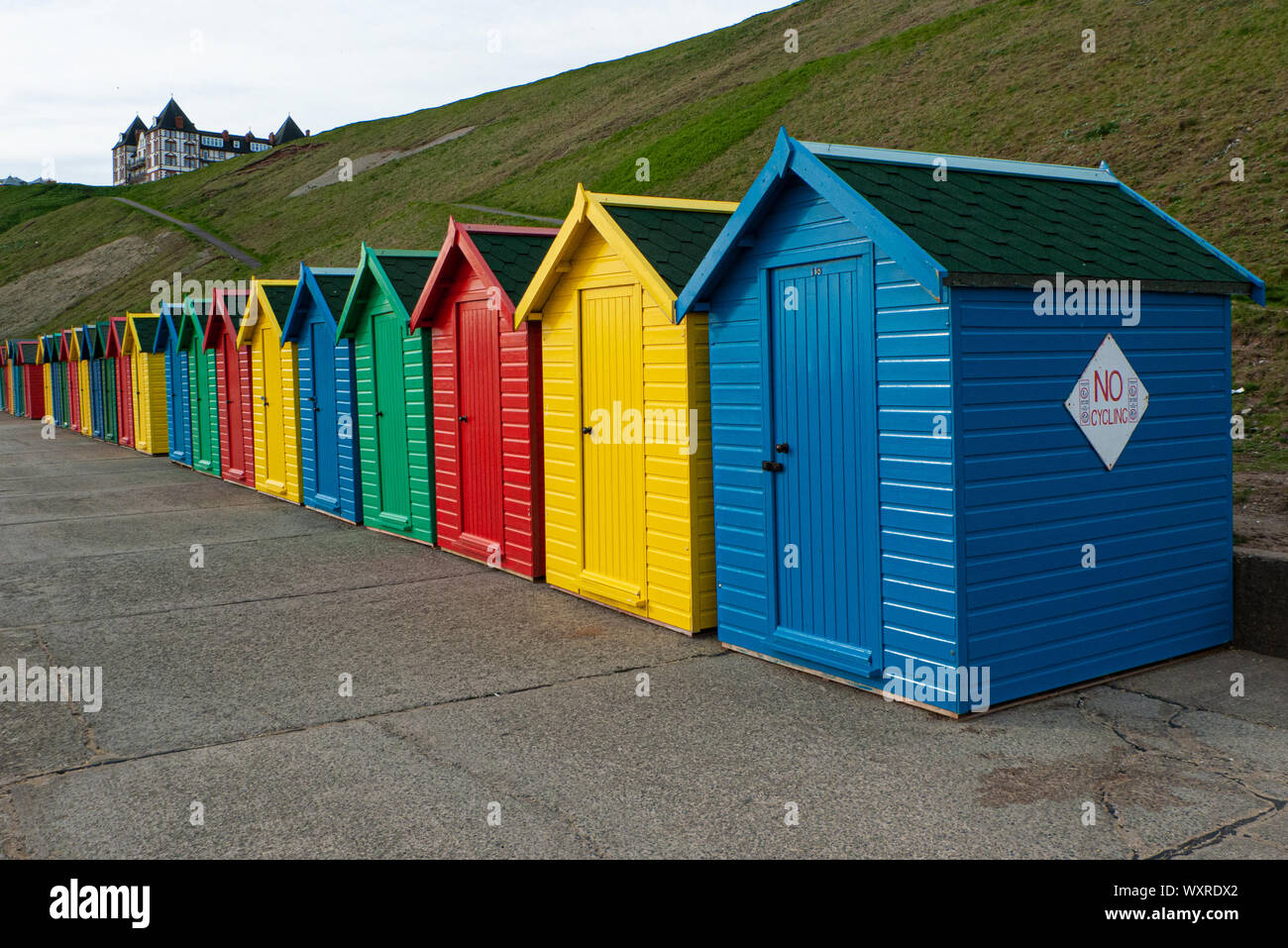 Row of colourful painted beach huts at Whitby, England Stock Photo - Alamy