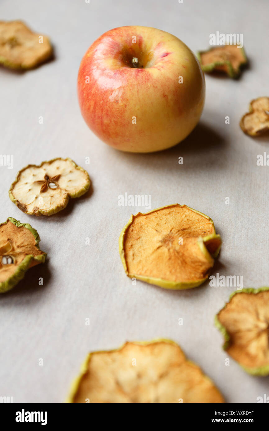 Fresh apple with pieces of dry apples on the table, top view Stock ...