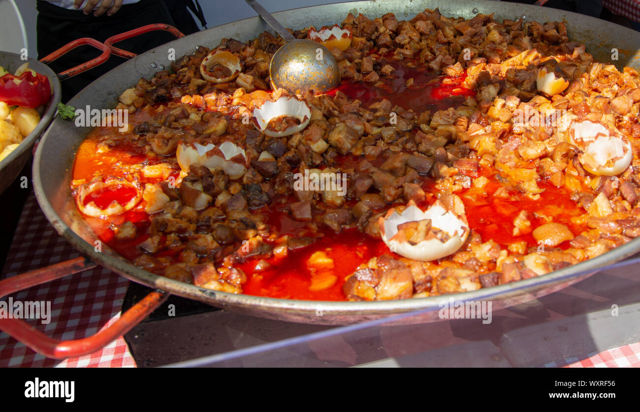 Paella in a paella dish photographed on a street food festival Stock ...