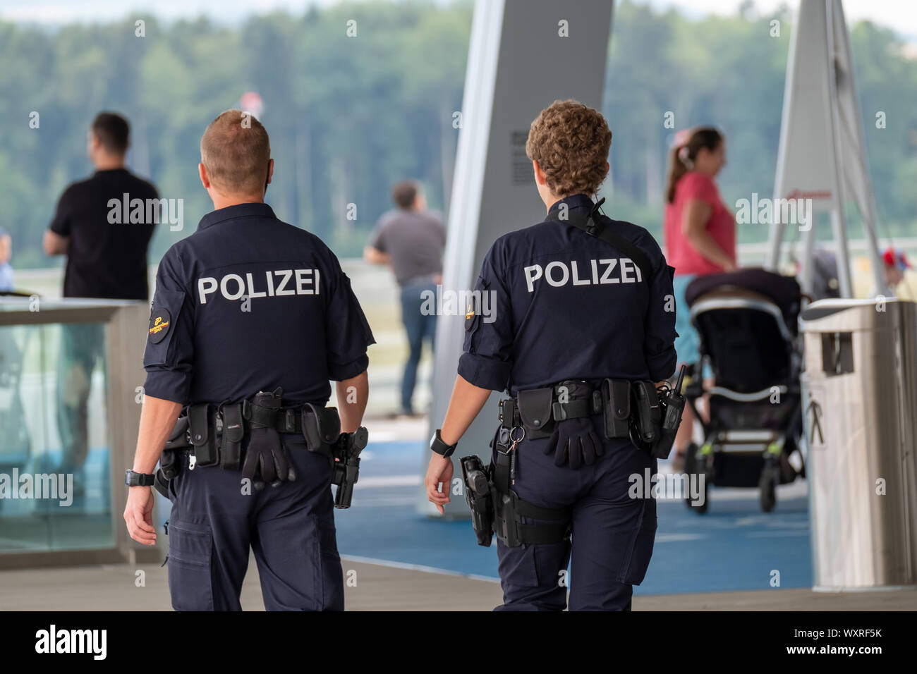 Police patrol two uniform teammates officers a man and a woman ...