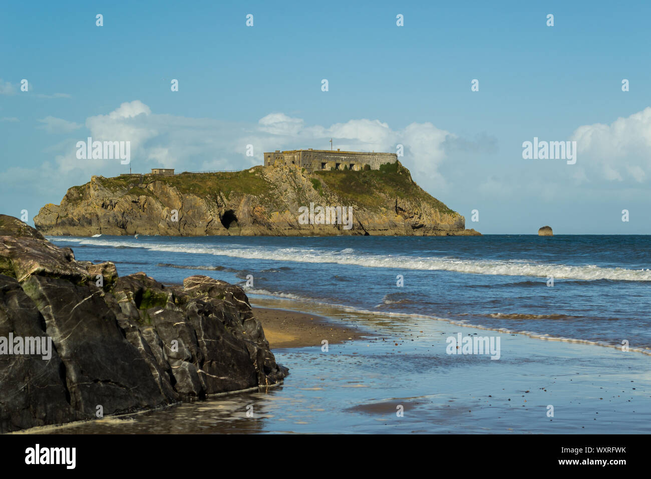 Coast with beach and monuments, Wales Stock Photo - Alamy