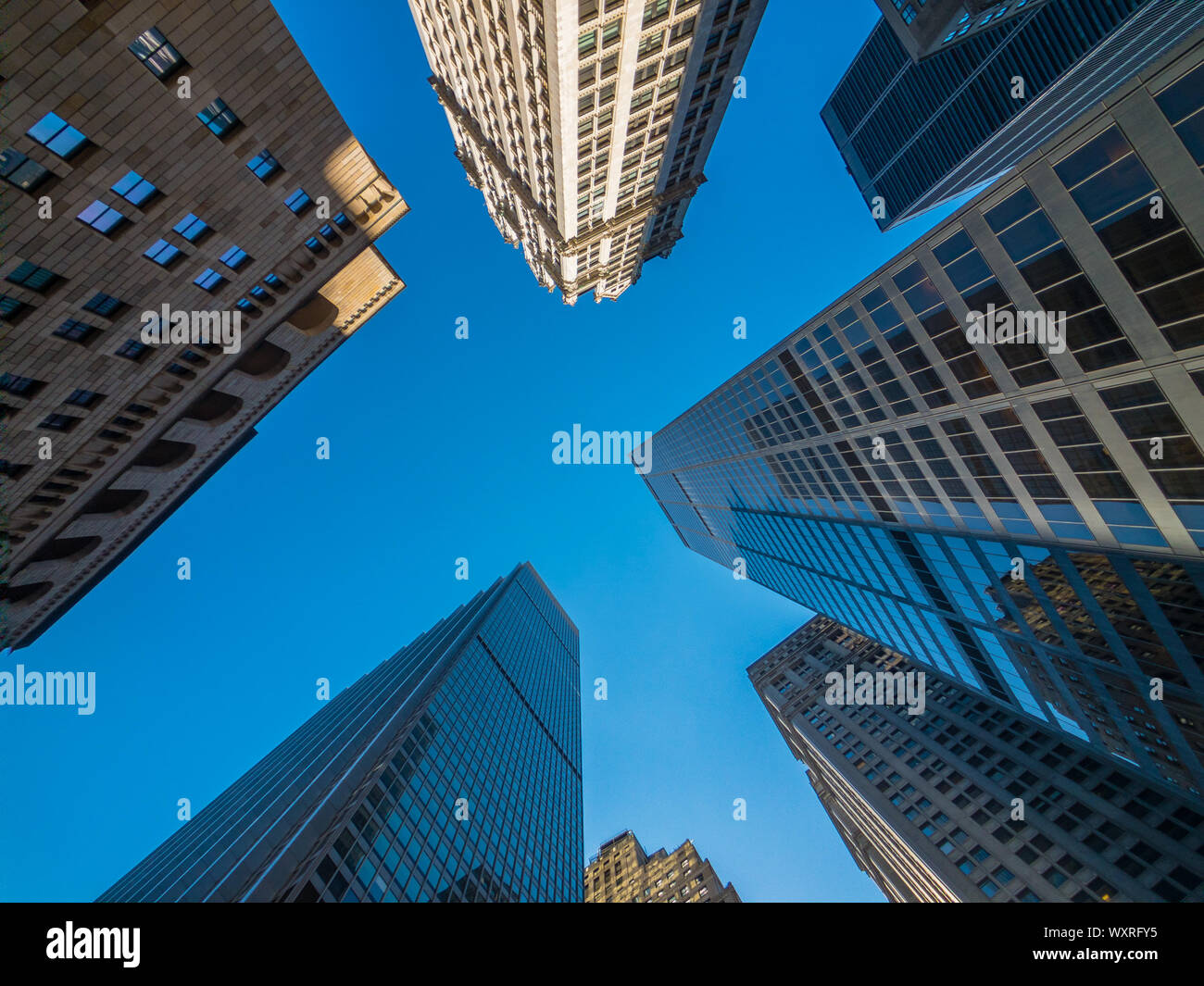 New York skyscrapers bottom view blue sky Stock Photo - Alamy