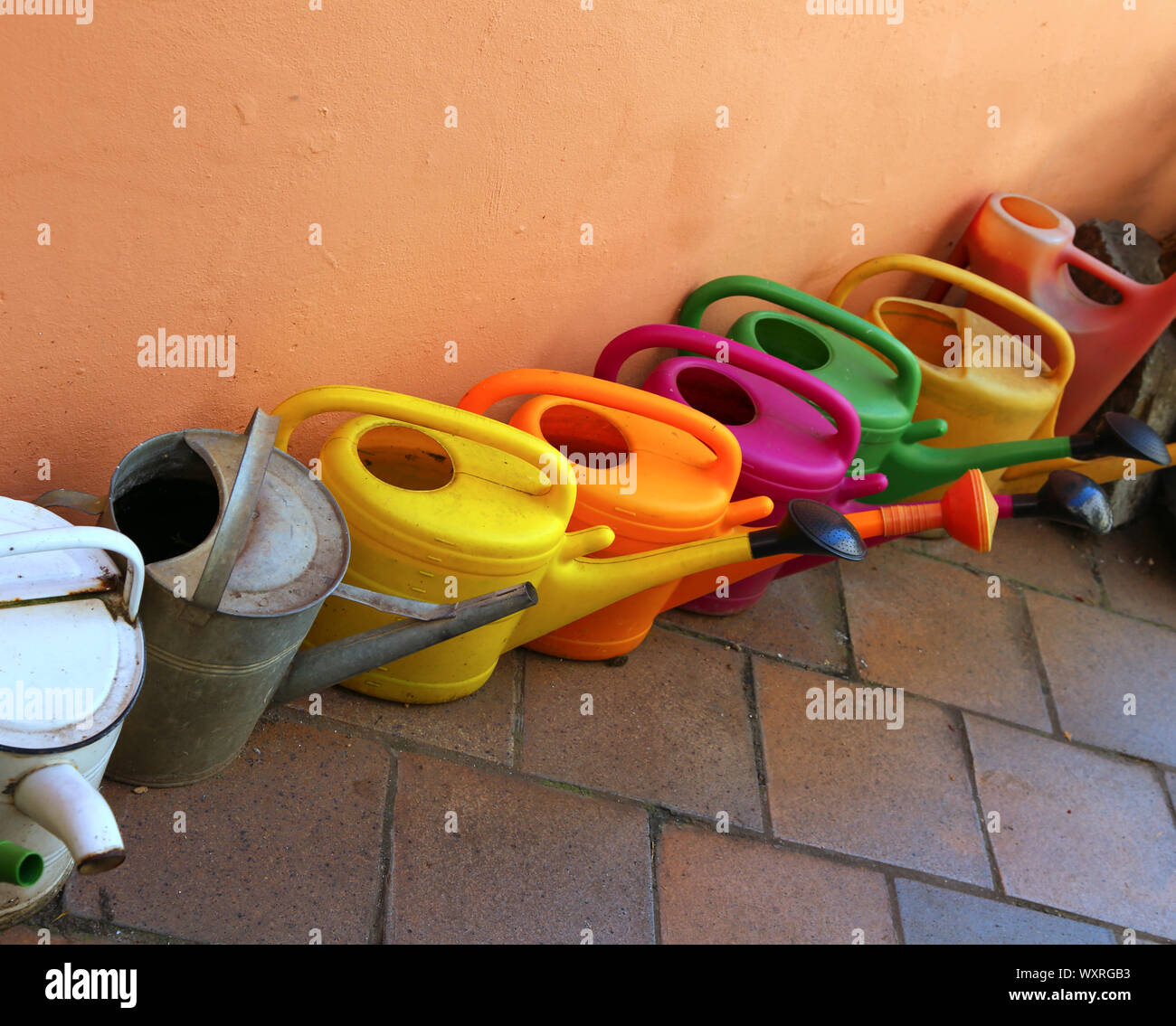 Many Colorful Watering Cans High Resolution Stock Photography and ...