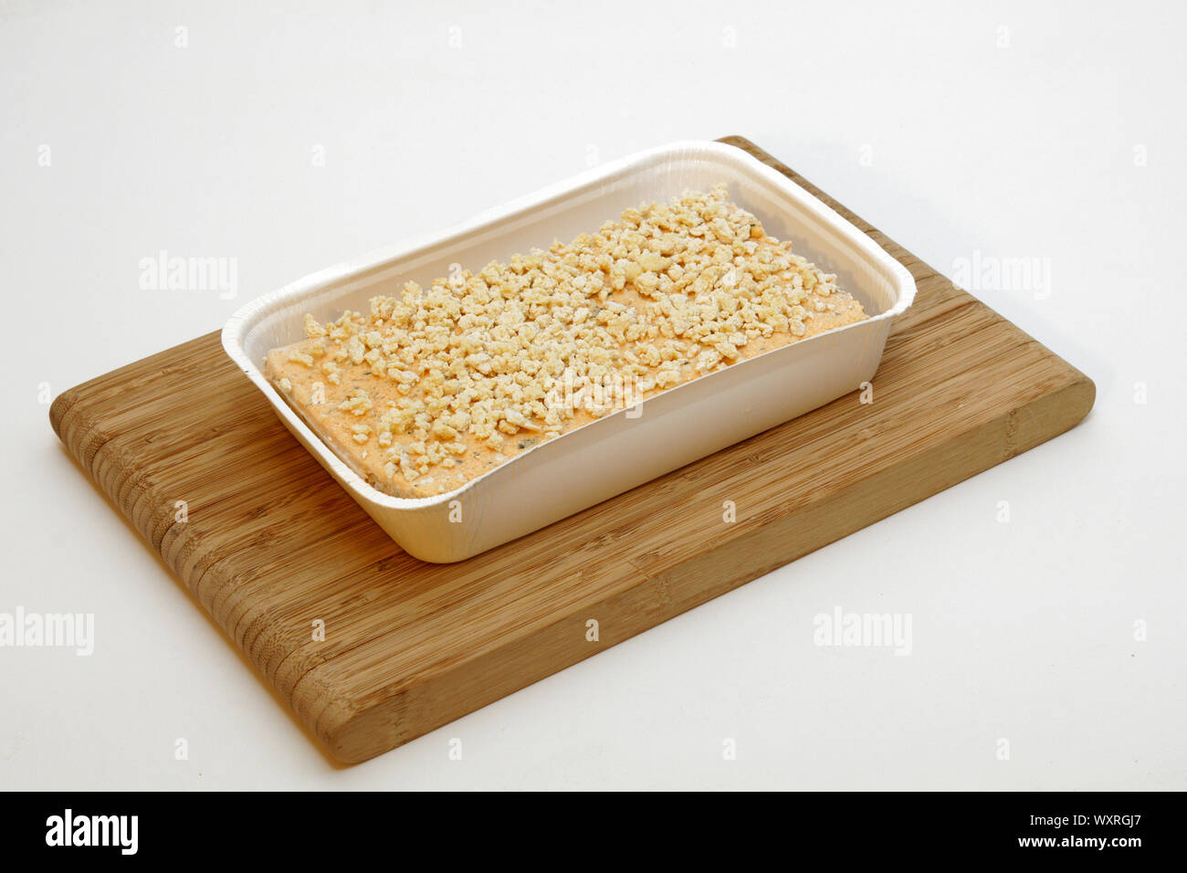 Frozen saithe fish fillet with herb crust Stock Photo - Alamy