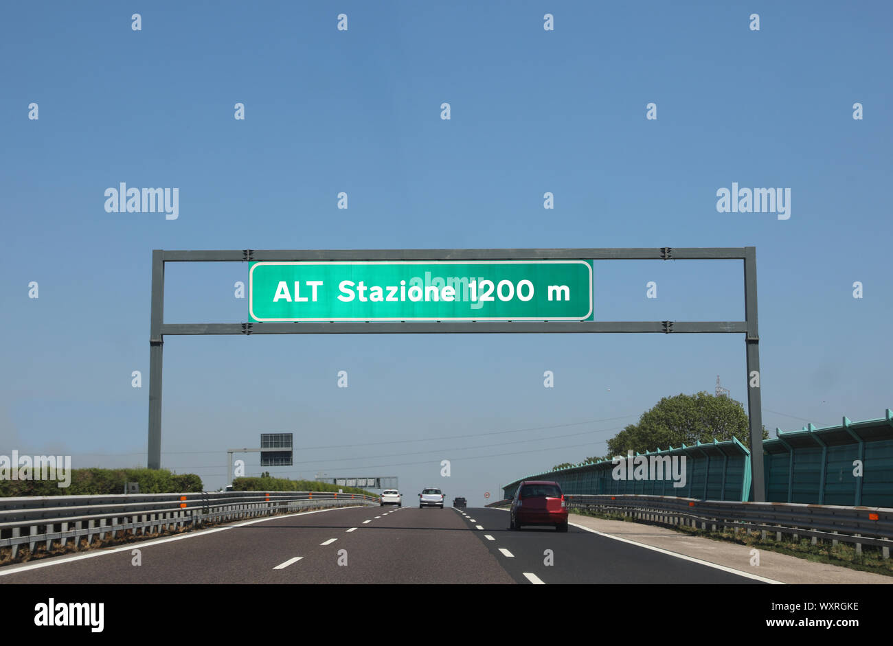 road sign with text ALT STATION 1200 m in Italian language at the end ...