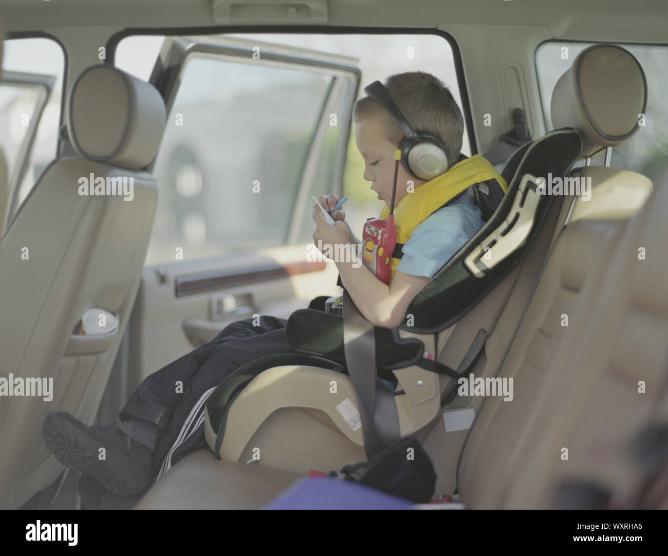 Boy in car seat Stock Photo - Alamy