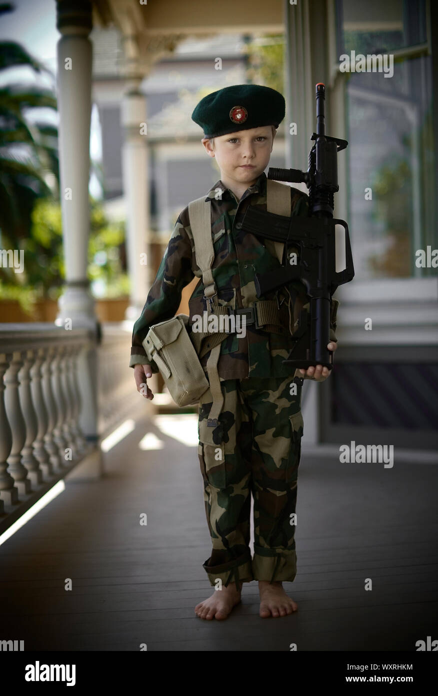 Boy in army uniform stands at a tension Stock Photo - Alamy
