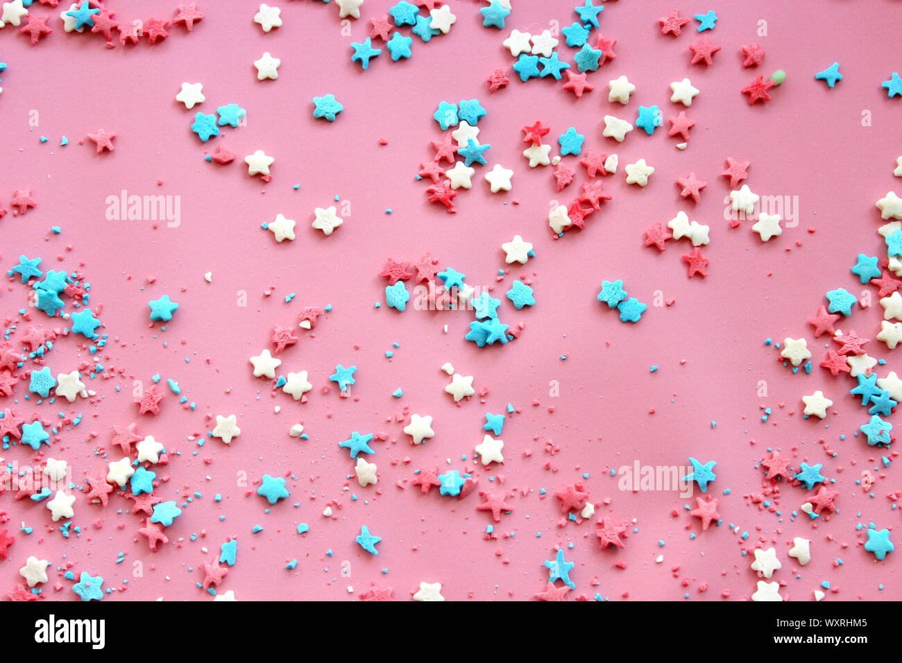 Sugar topping for cake, frame on a pink background, free space for text ...