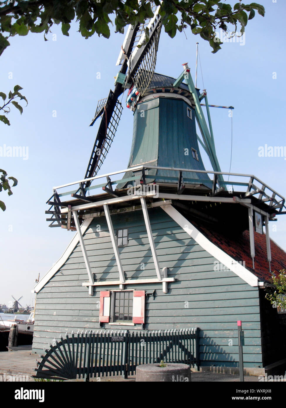 blue windmill which was put on a residential house Stock Photo - Alamy