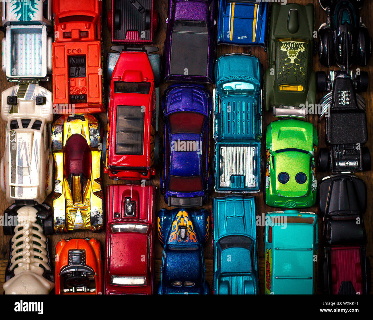 small toy cars in many colors formed and grouped Stock Photo - Alamy