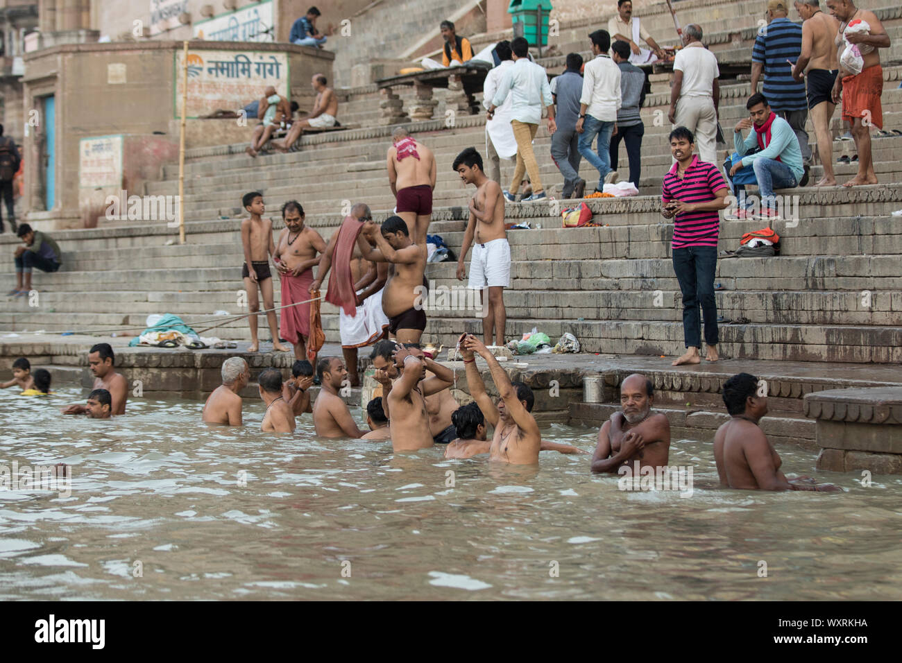 Morning sacred bath scene at the river bank of Varanasi Stock Photo - Alamy