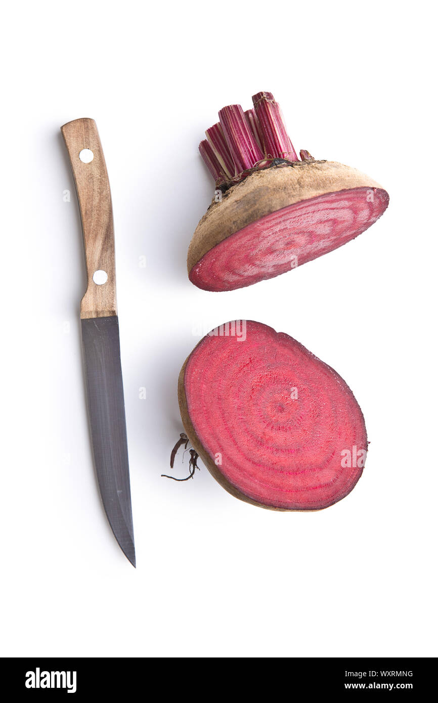 Tasty raw beetroot. Sliced beetroot and knife isolated on white ...
