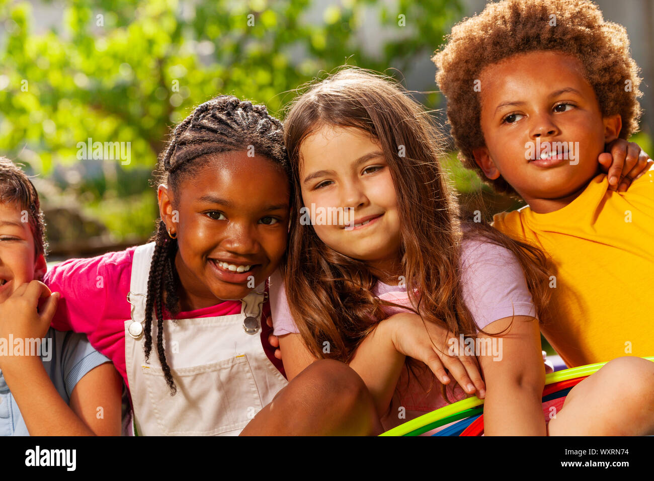Close-up portrait of kids group hug and smiling Stock Photo - Alamy