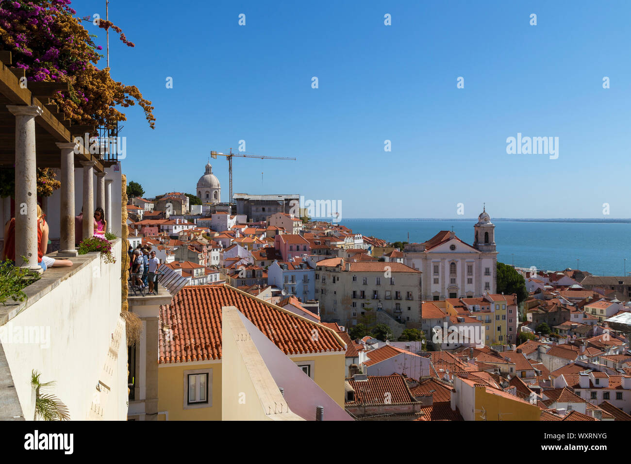 Few people at the Miradouro de Santa Luzia viewpoint and view of Tagus ...