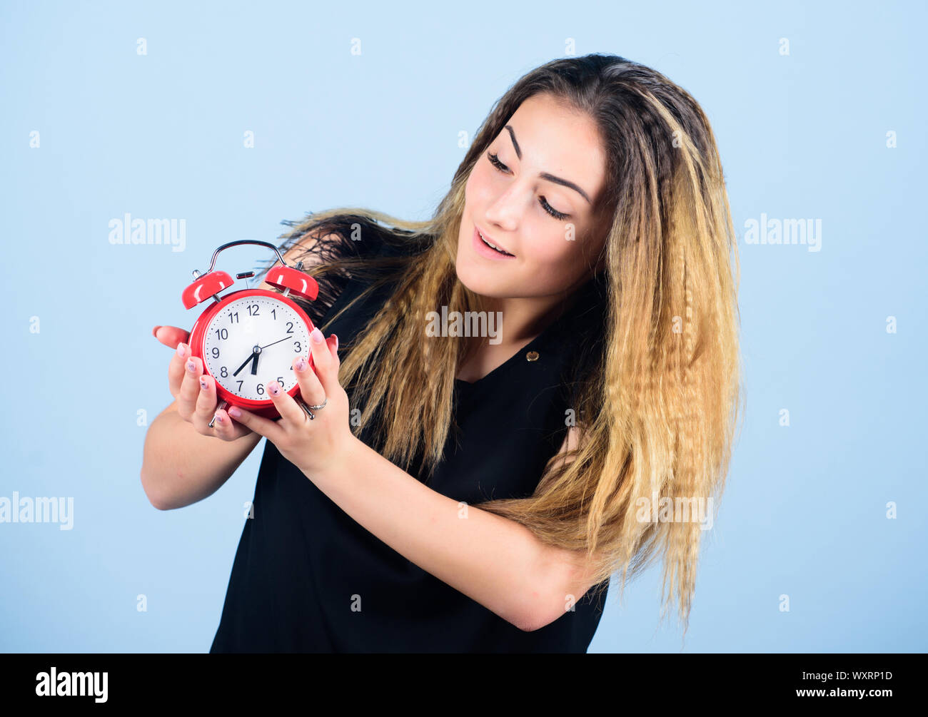 Woman hold vintage alarm clock. Practice of advancing clocks. Daylight ...