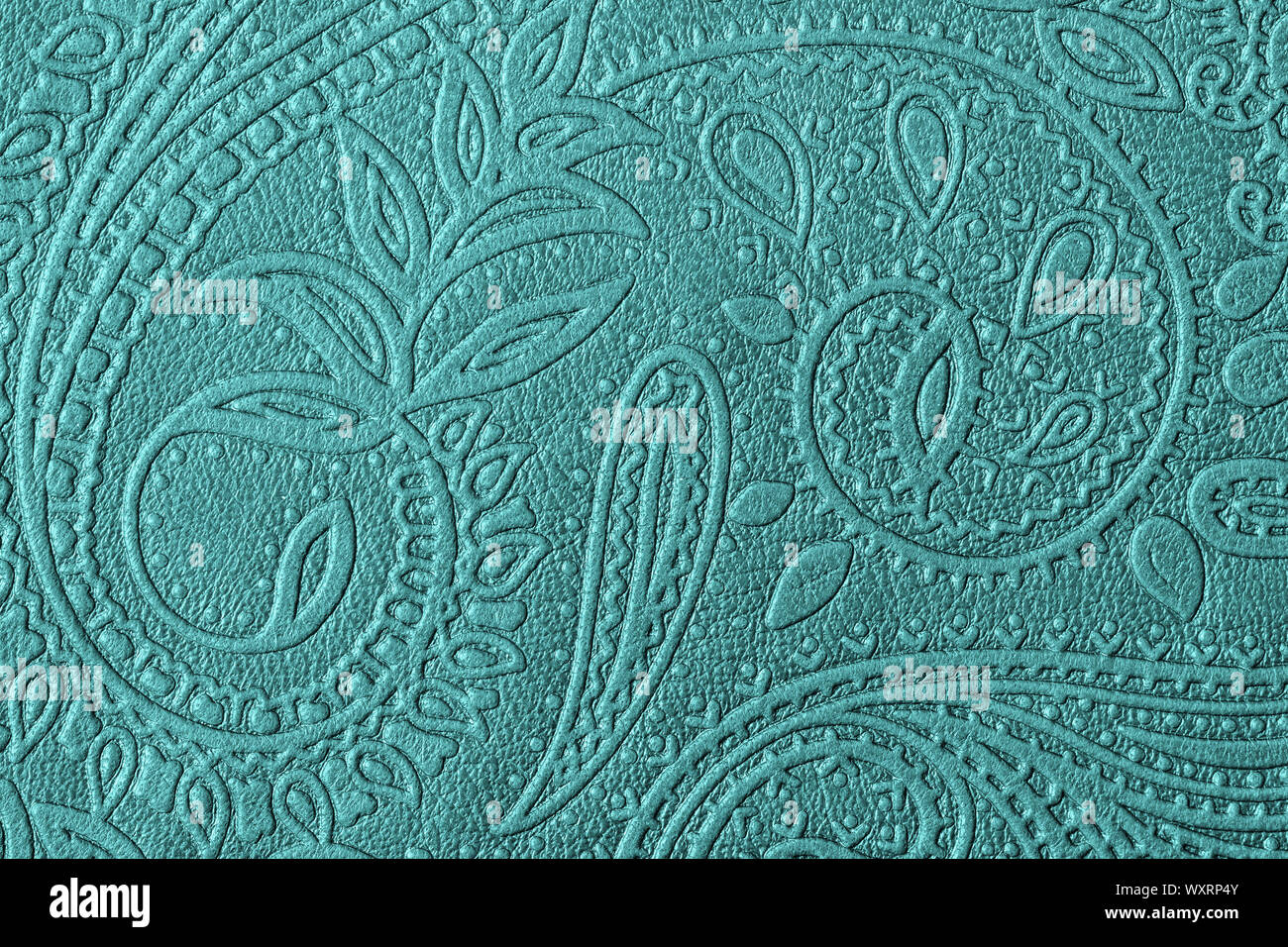 Texture of genuine leather with embossed floral trend pattern close-up ...
