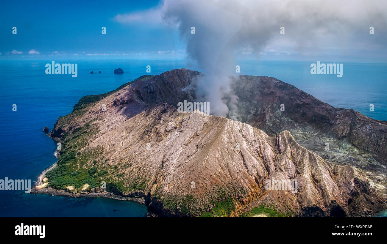 Approaching White Island / Whakaari volcano by helicopter. Bay off ...