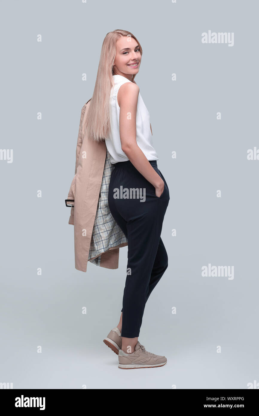 side view. smiling young woman looking at camera Stock Photo - Alamy