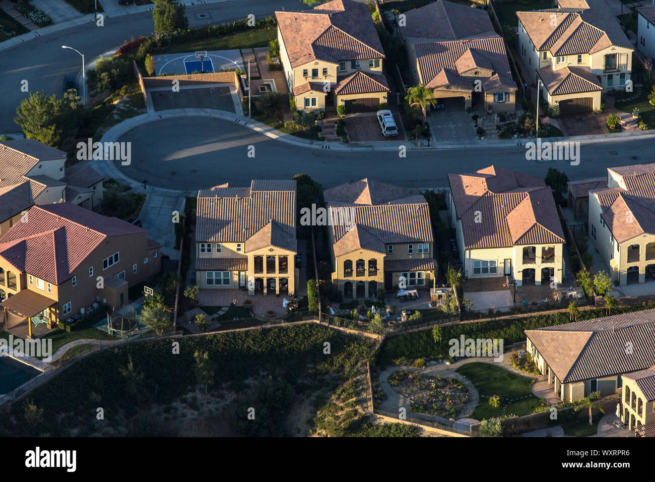 Aerial afternoon view of suburban homes on cul-de-sac street in the San ...