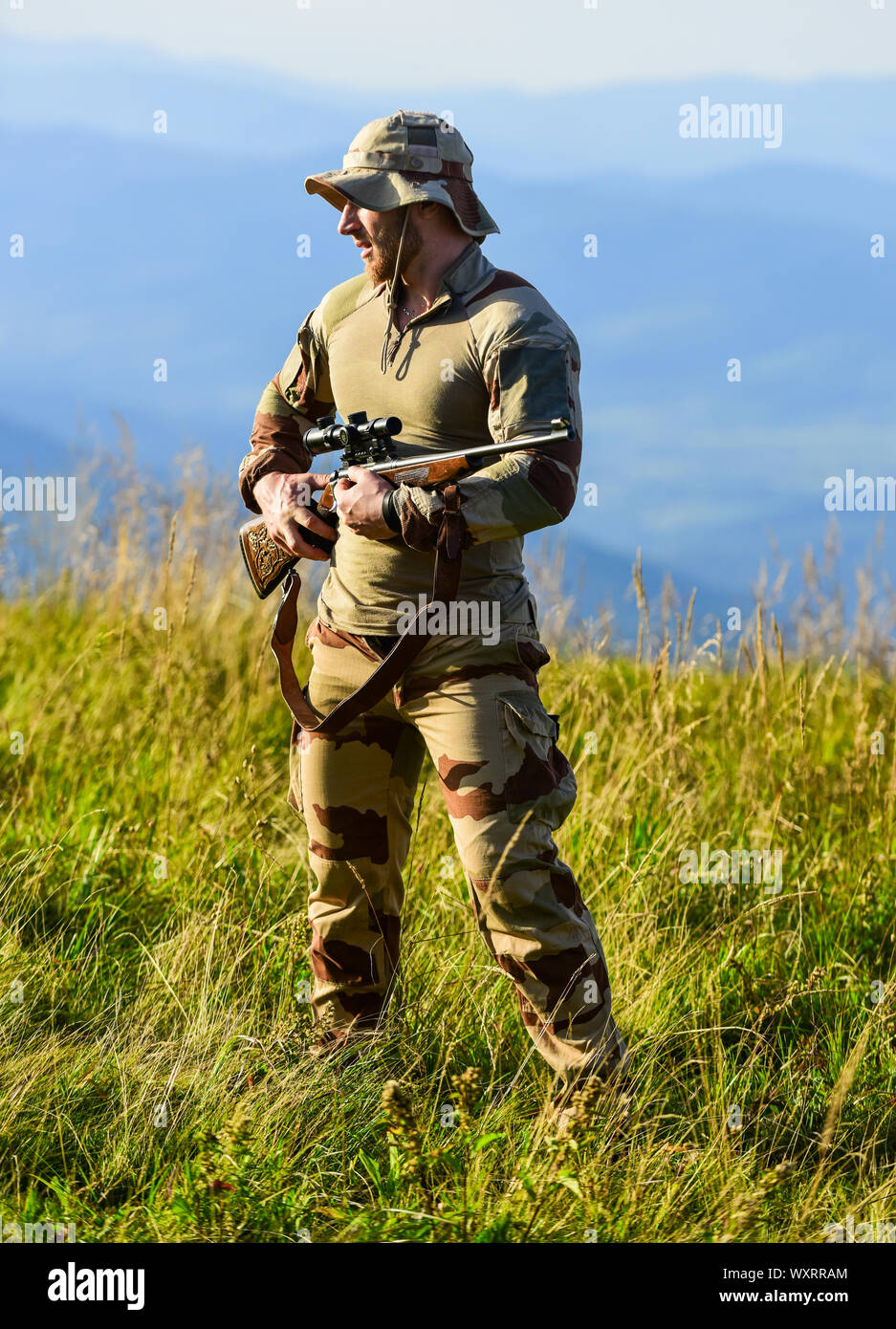 Army forces. Ready to shoot. Hunter hold rifle. Hunter mountains ...