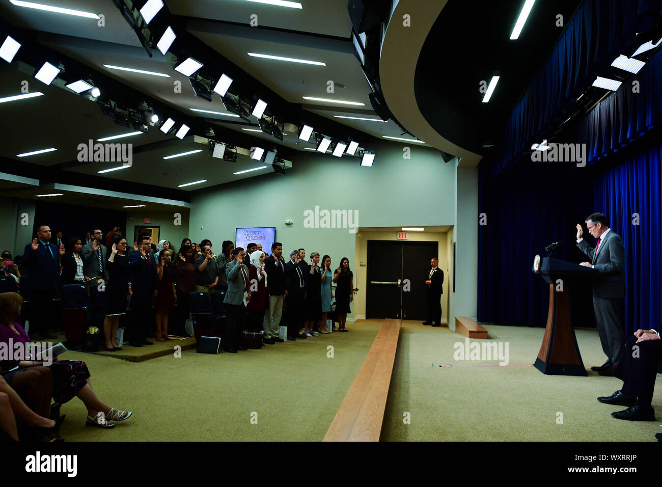People take the oath of citizenship during a White House naturalization ...