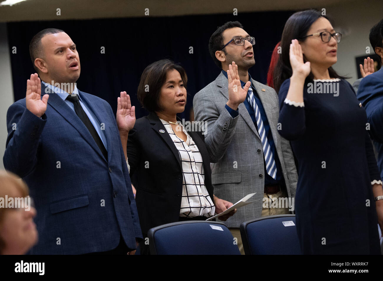 People take the oath of citizenship during a White House naturalization ...