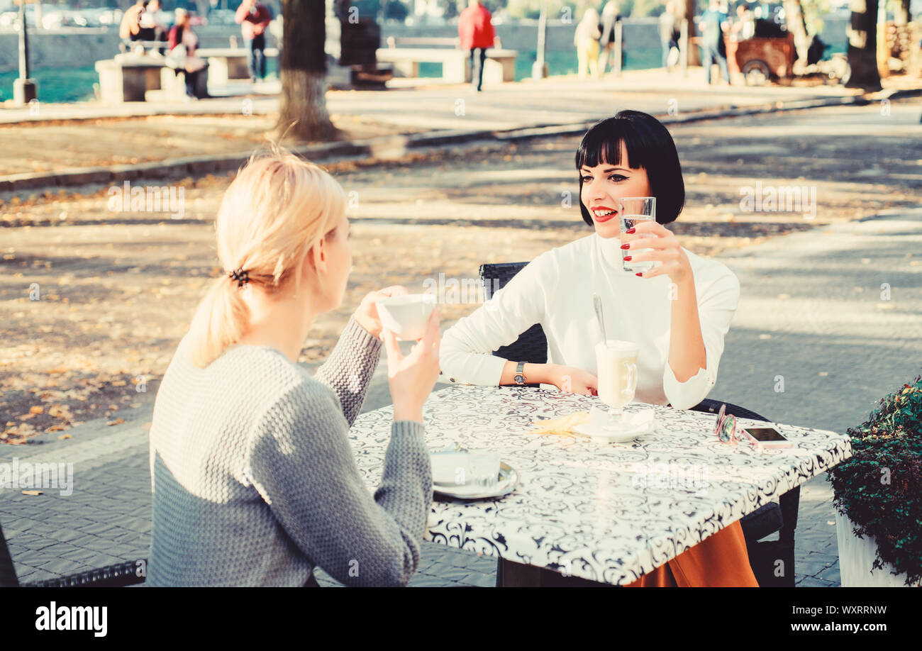 Conversation of two women cafe terrace. Friendship meeting ...