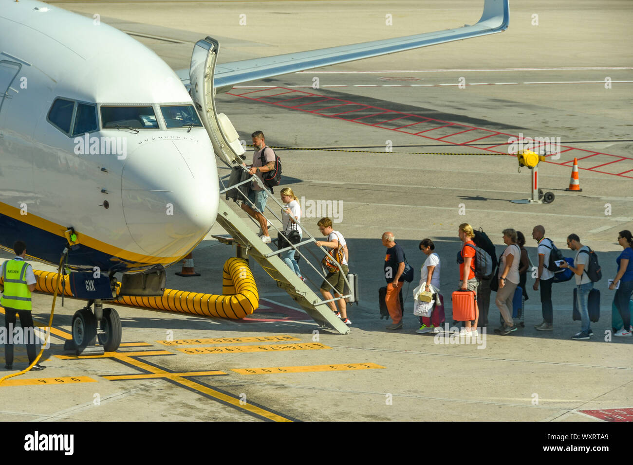 NAPLES, ITALY - AUGUST 2019: Passengers boarding a Ryanair Boeing 737 ...