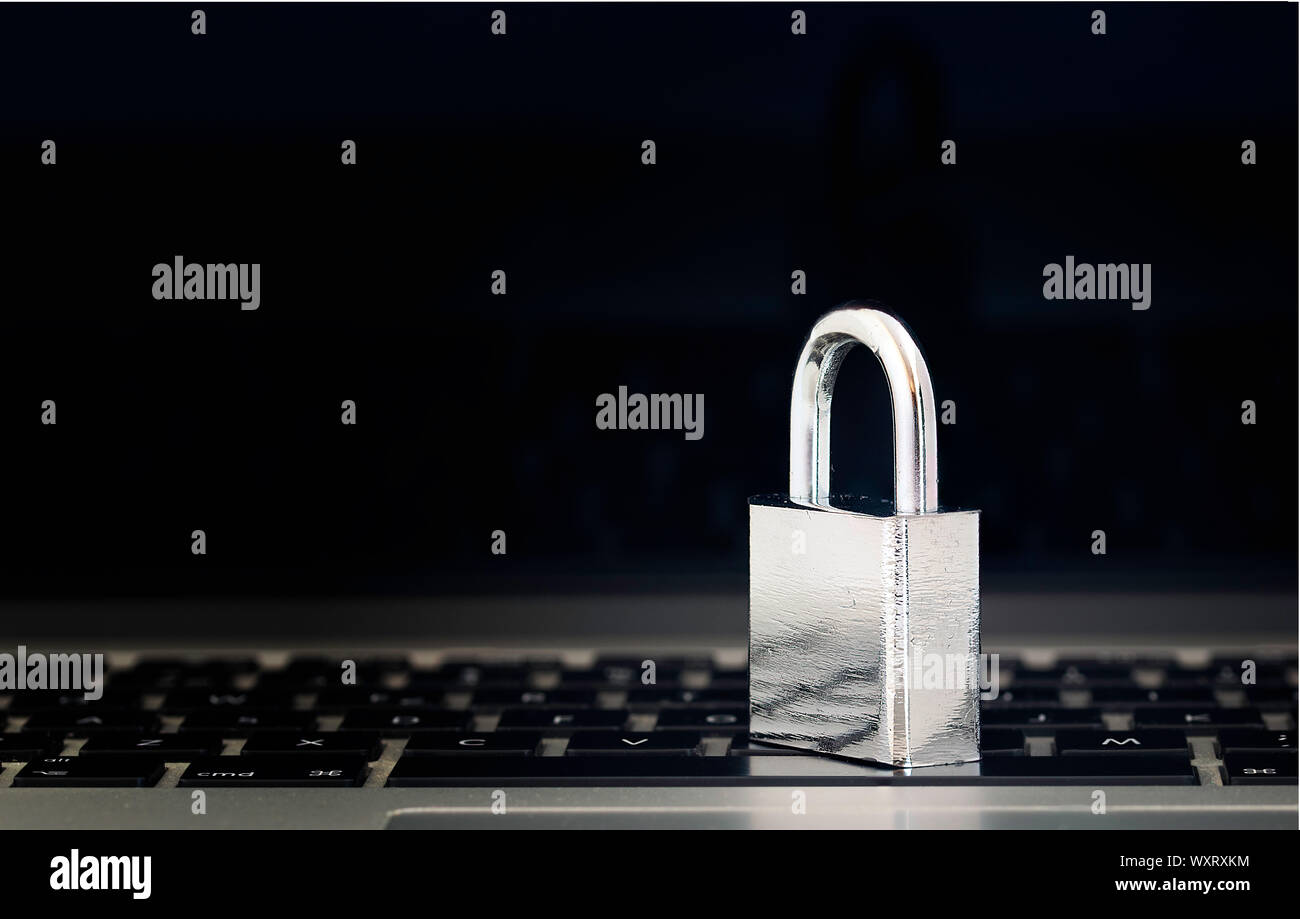 Computer Security Concept with a Closed Padlock on the Keyboard on Black Background With ...
