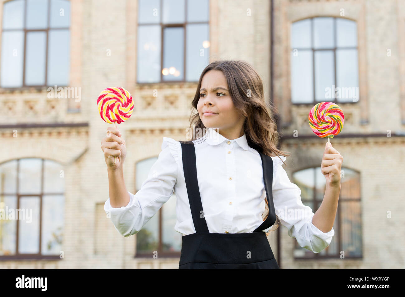 Child choosing flavour hi-res stock photography and images - Alamy