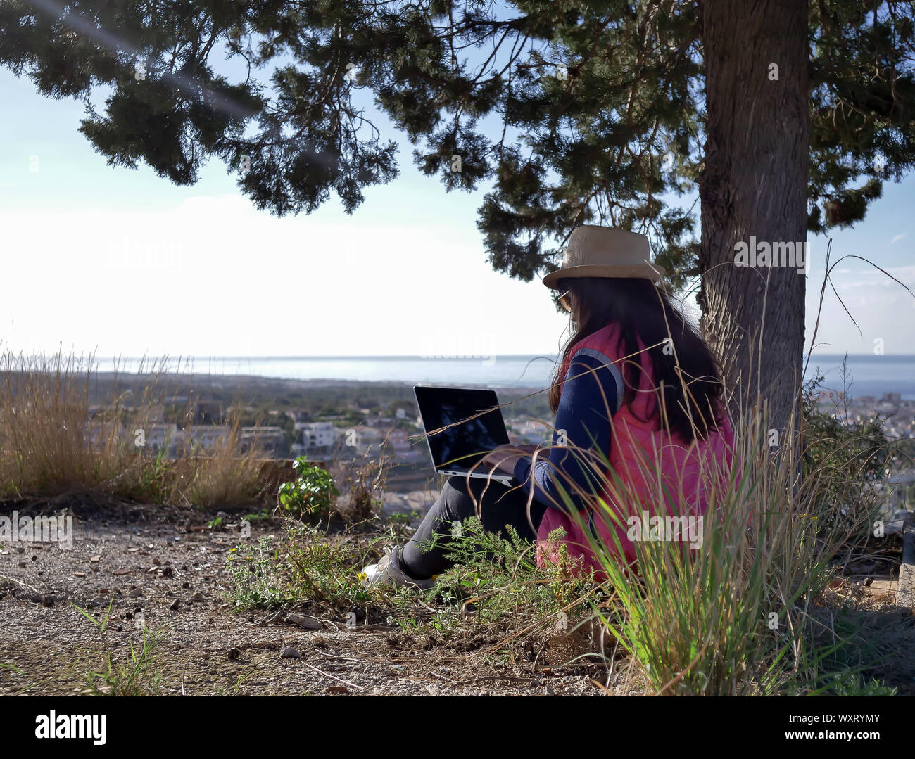 Man sitting in shade under hi-res stock photography and images - Alamy