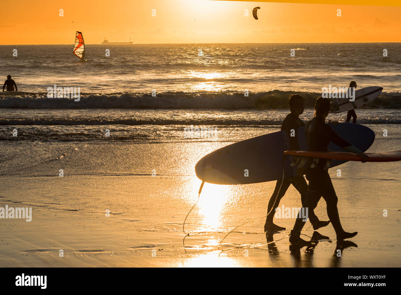 Surf and Sunset Stock Photo - Alamy