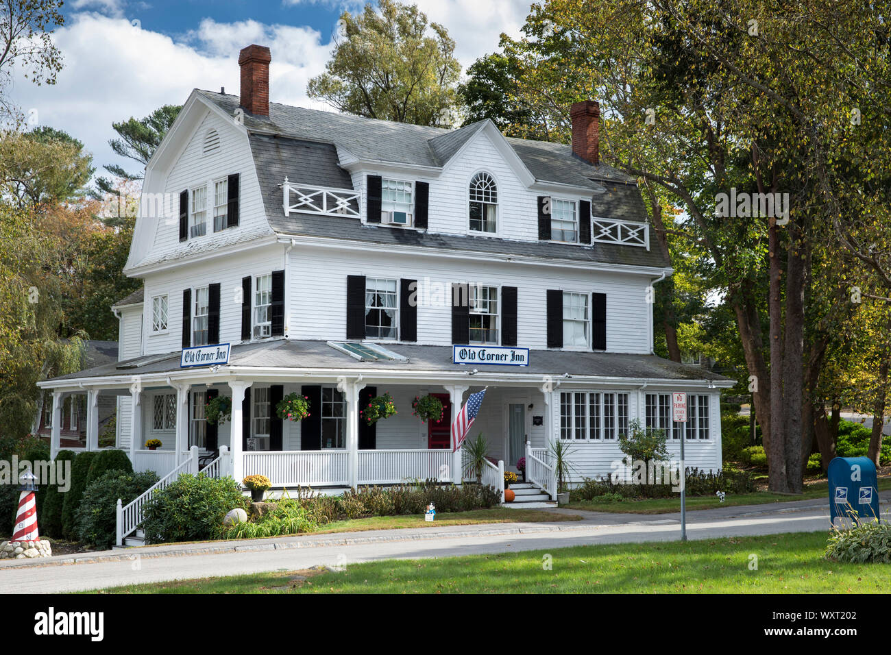 Wooden clapboard Old Corner Inn with patriotic Stars and Stripes flag ...