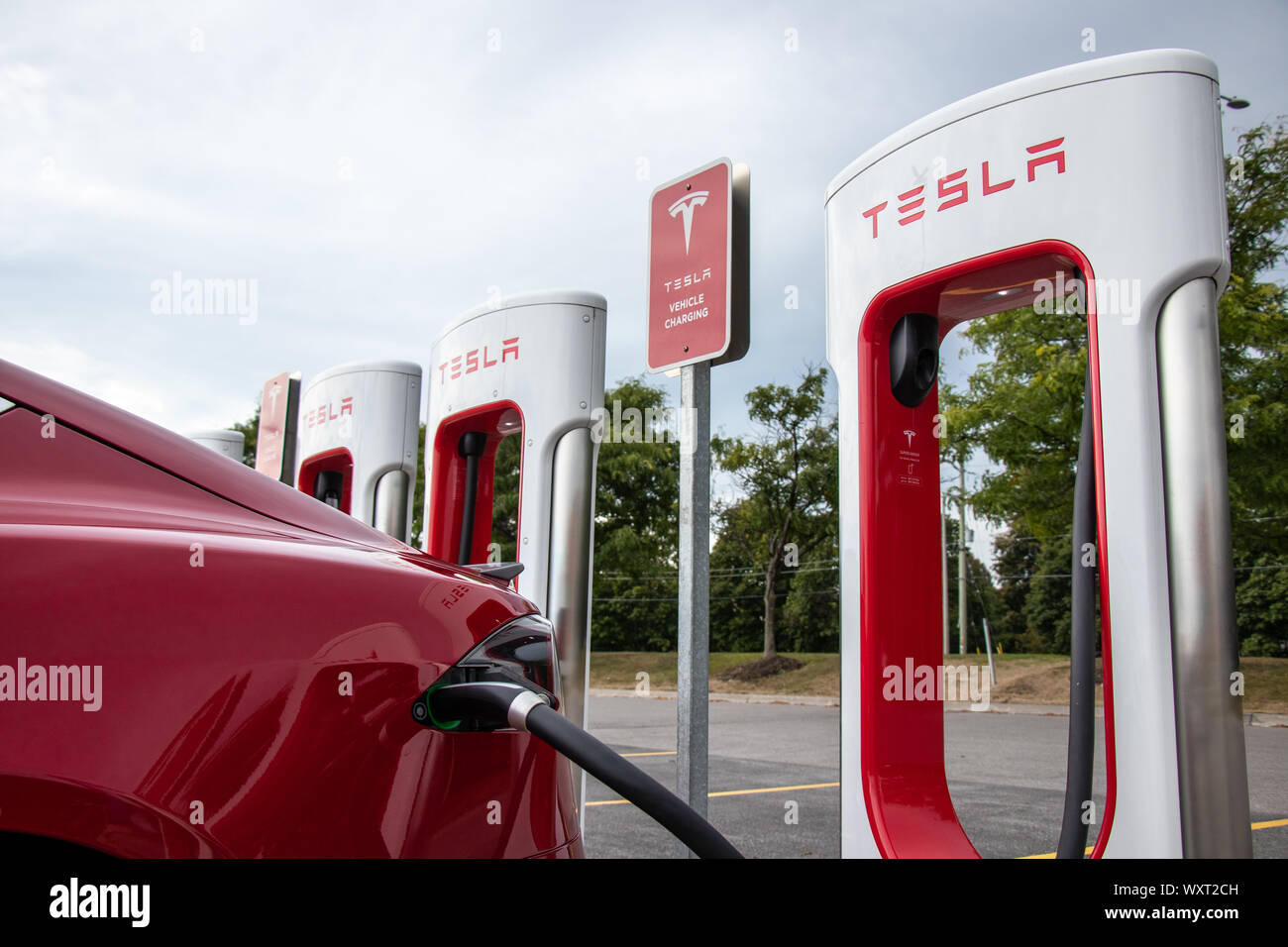 Tesla Model S plugged into Tesla Supercharger Stock Photo - Alamy