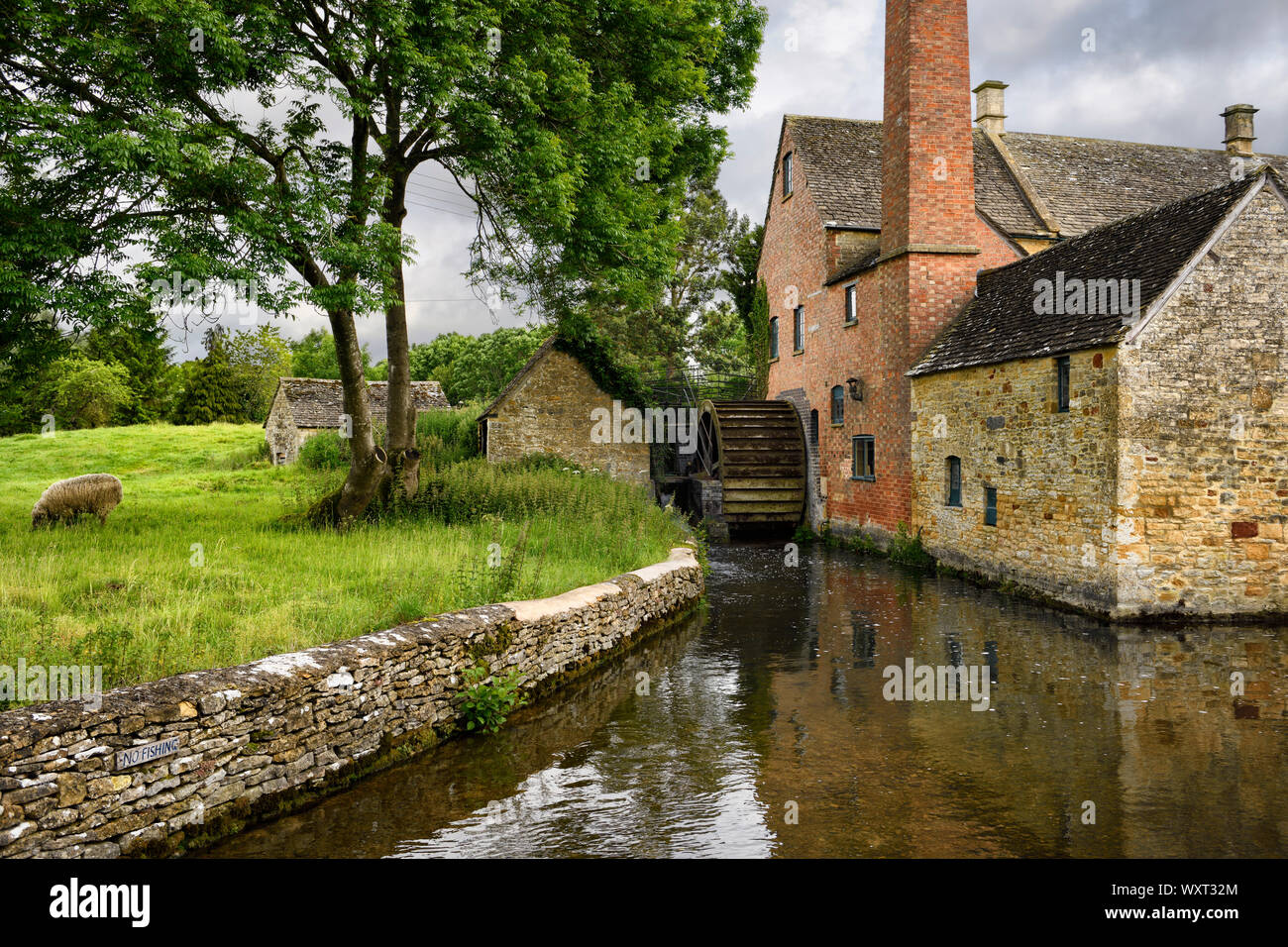 The Old Mill museum with undershot waterwheel on the River Eye with ...