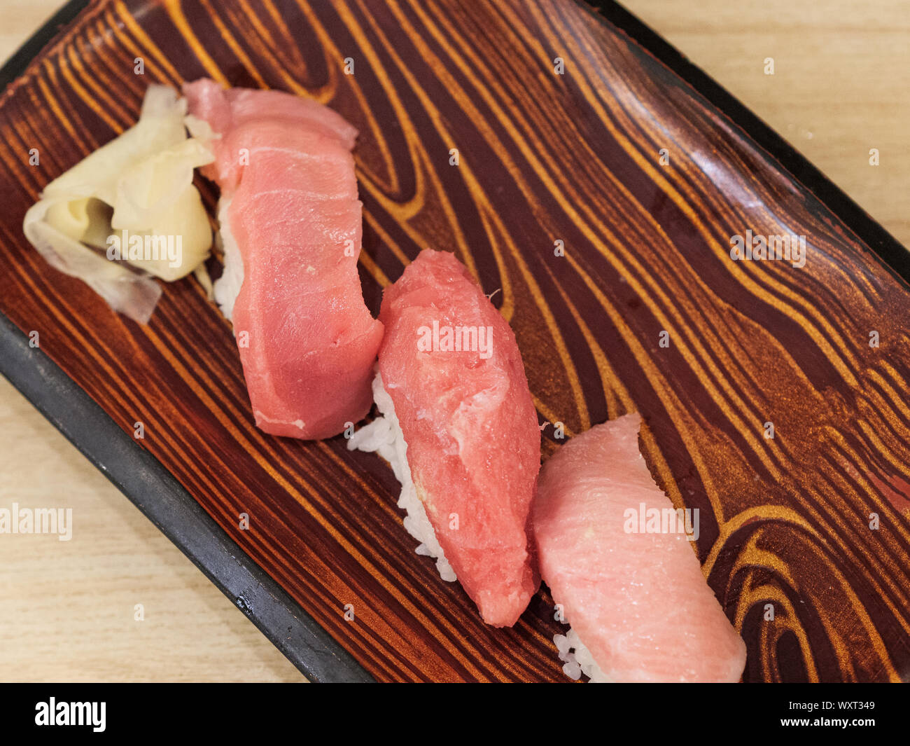 A set of three tuna sushi on a plate, Akami, chuutoro and ootoro Stock ...