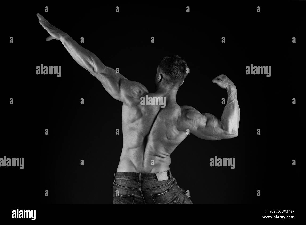 Attractive guy muscular body. Proud of excellent shape. Bodybuilder ...