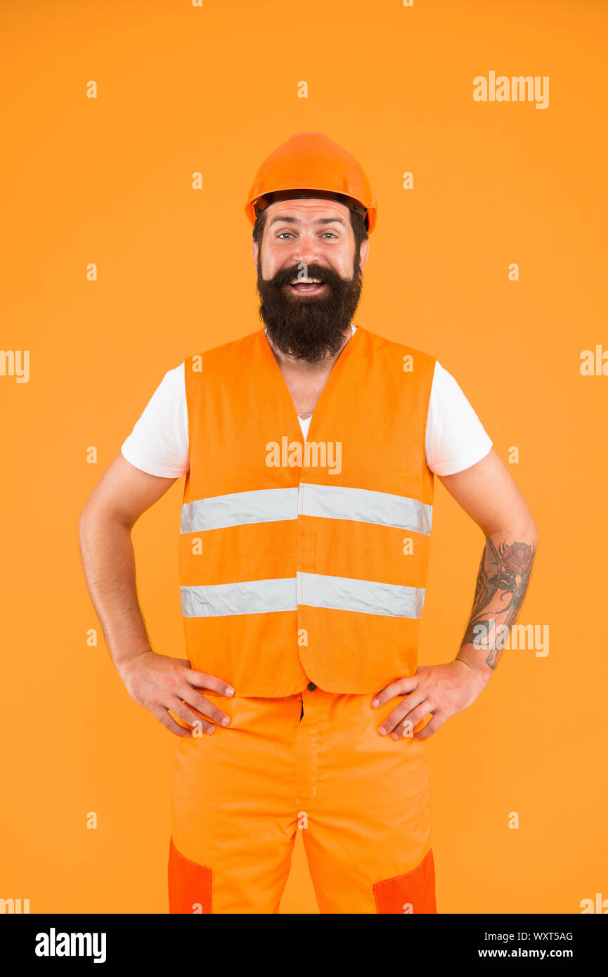 Skilled professional. Happy professional worker on orange background ...