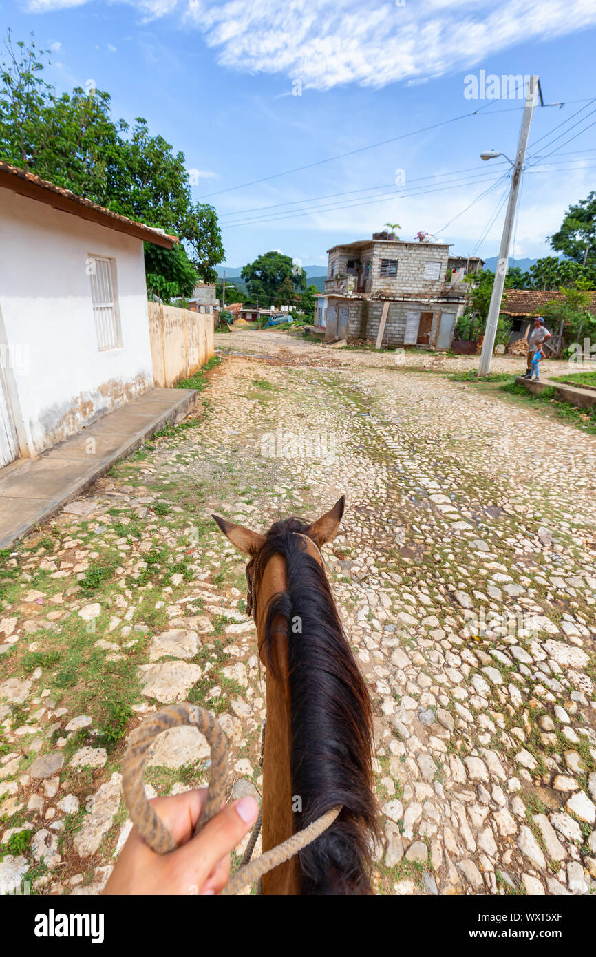 Trinidad, Cuba - June 12, 2019: Riding on top of a Horse in the streets ...