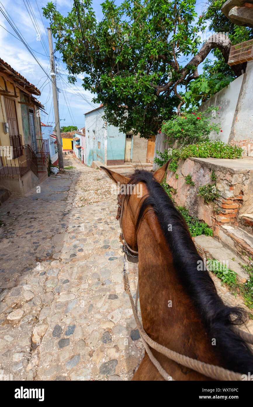 Riding on top of a Horse in the streets of a small Cuban Town during a ...