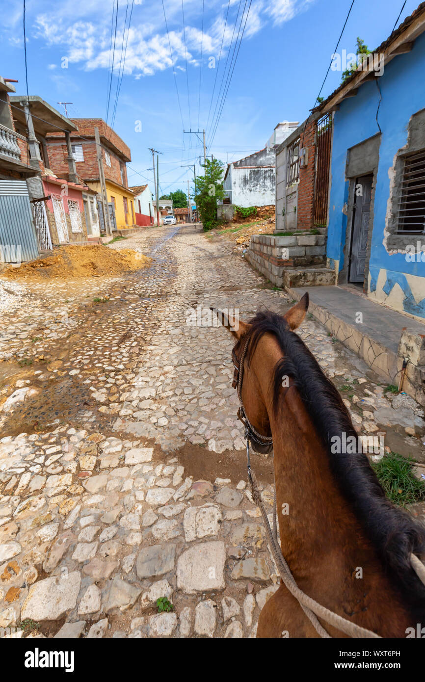Riding on top of a Horse in the streets of a small Cuban Town during a ...
