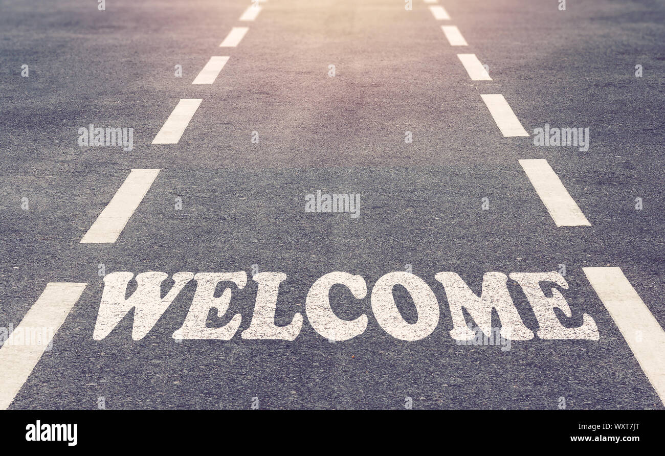 Welcome banner with text concept on road background, vintage and retro ...