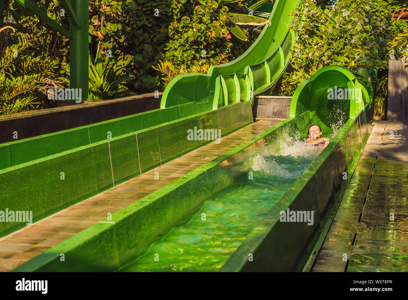 Man having fun at the water park Stock Photo - Alamy
