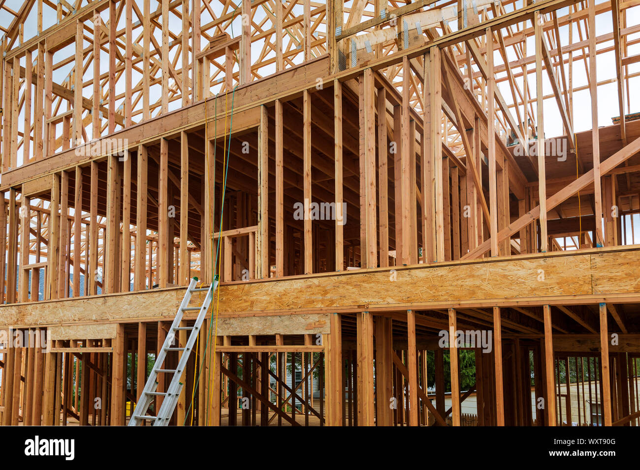 Exterior view construction new residential home framing Stock Photo - Alamy